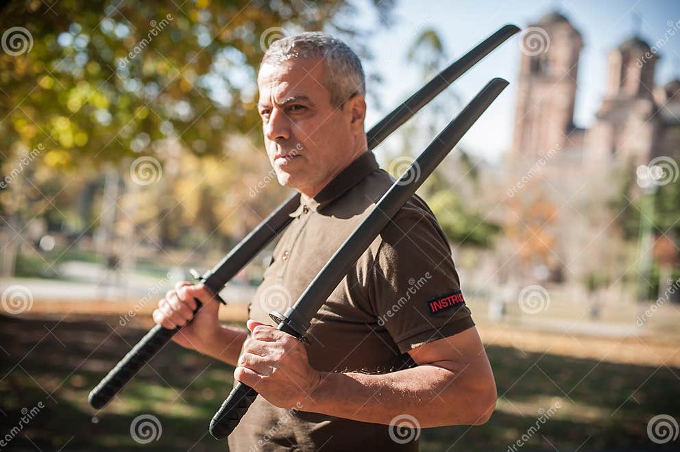 Instructor Demonstrates Katana Sword Fighting Techniques and Training ...