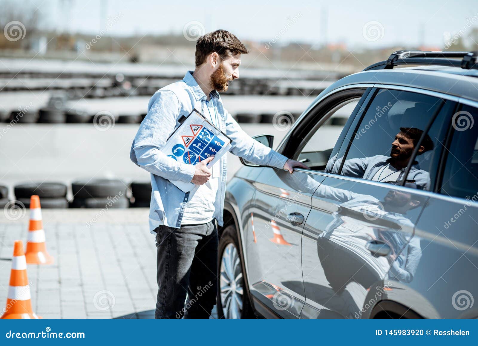 Instructor with Driver on the Training Ground Stock Photo - Image of ...