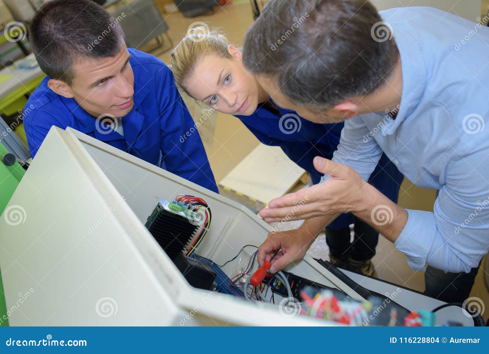 Instructor Explaining Wiring To Trainee Electricians Stock Photo ...
