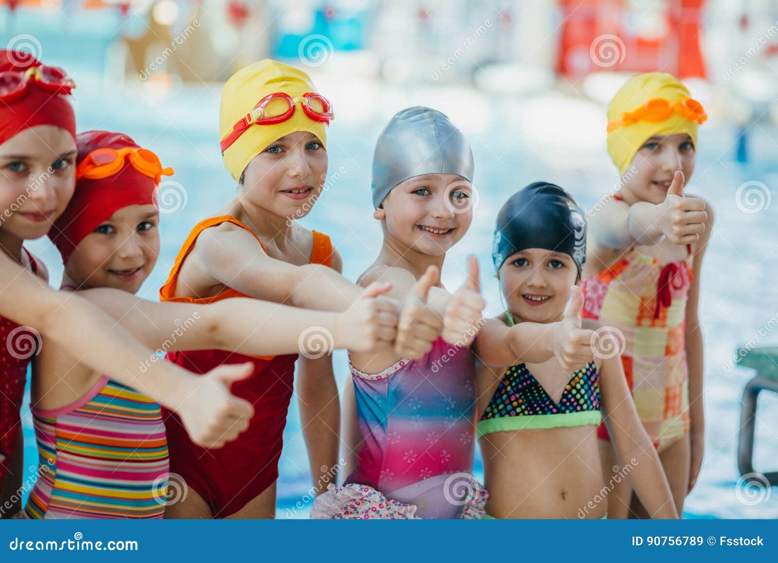 Instructor and Group of Children Doing Exercises Near a Swimming Pool ...