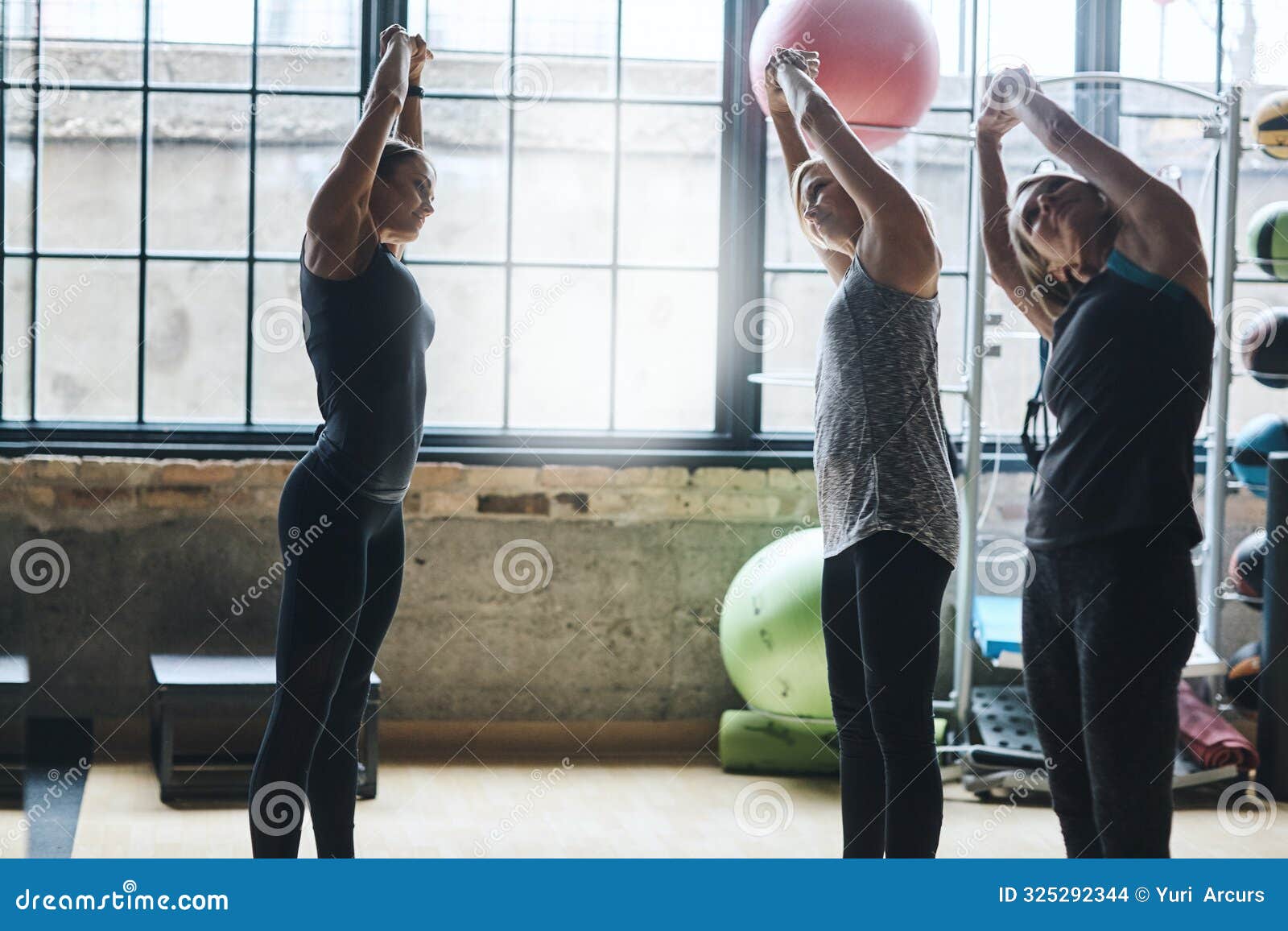 Instructor, Group and Stretching in Gym with Training for Arm Exercise ...