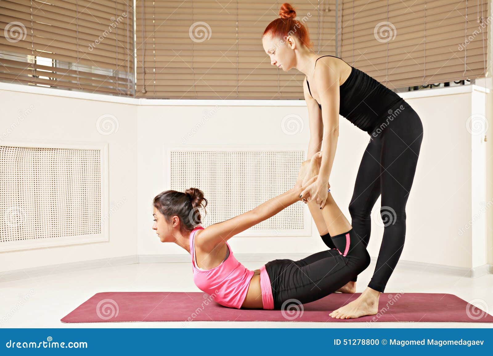 Instructor Helping in Back Bend Pose Stock Photo - Image of redhead ...