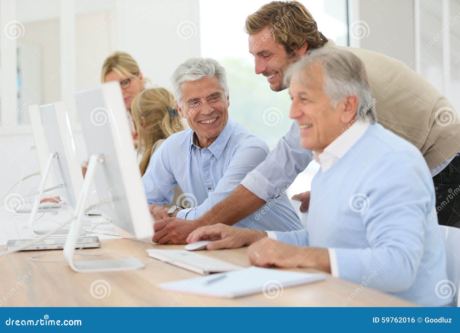 Instructor Helping Seniors in Informatics Stock Photo - Image of ...