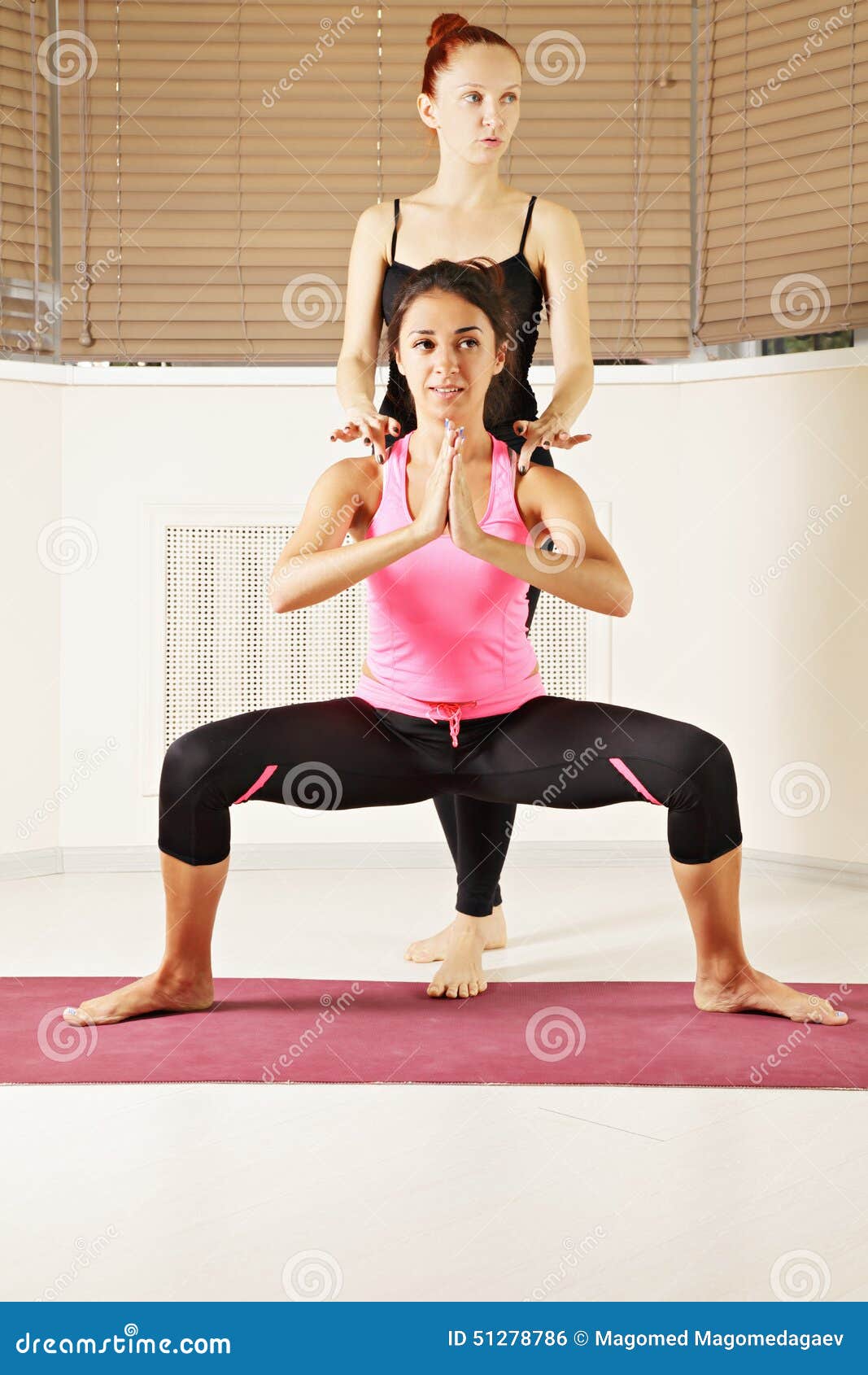 Instructor Helping in Standing Pose Stock Photo - Image of posture ...