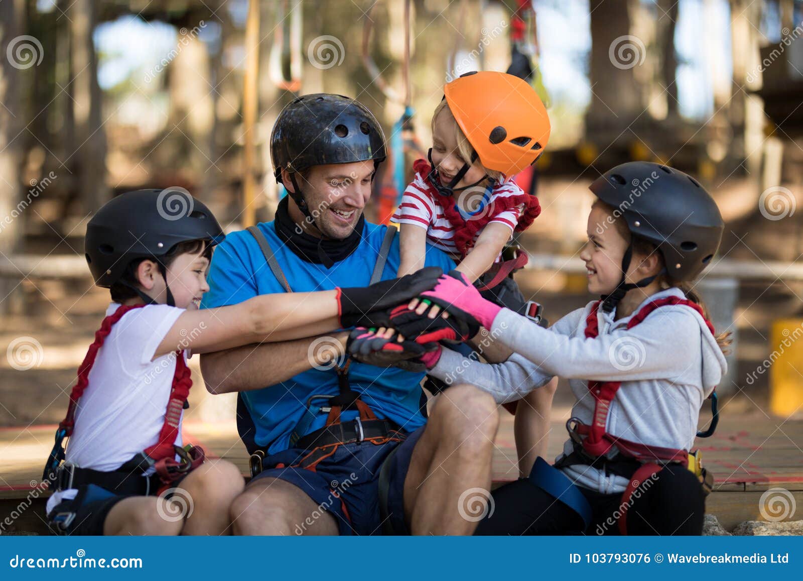 Instructor and Kids Forming Hand Stack in Park Stock Photo - Image of ...