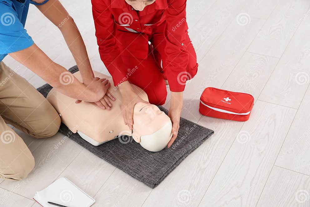 Instructor and Man Practicing First Aid Stock Photo - Image of ...