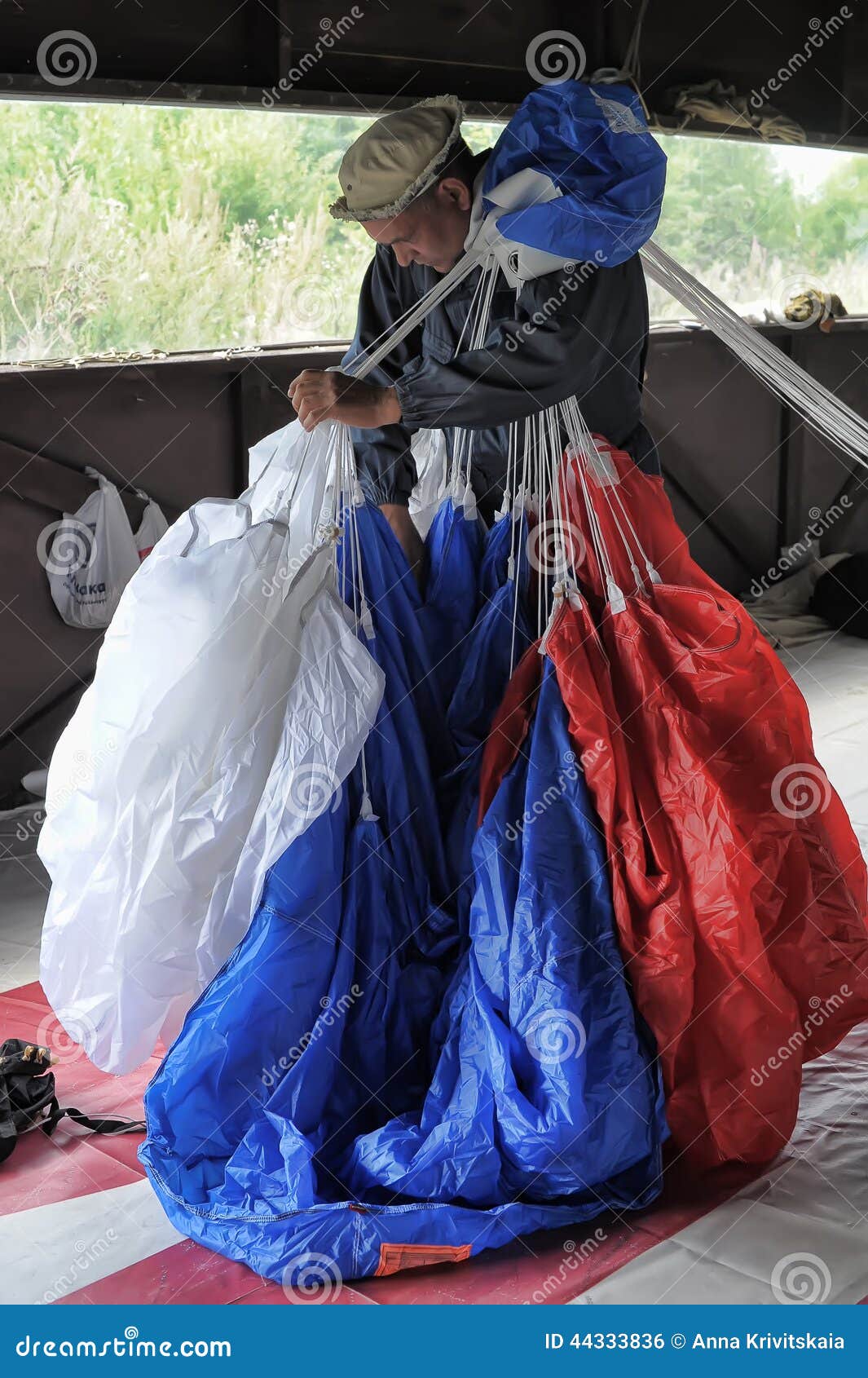 Instructor Parachute Packs in a Backpack before Jumping Editorial Photo ...