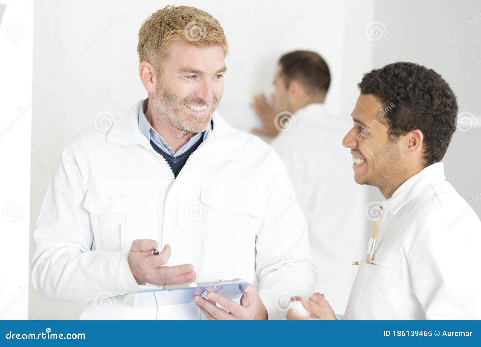 Instructor Showing Apprentices How To Paint Stock Image - Image of ...