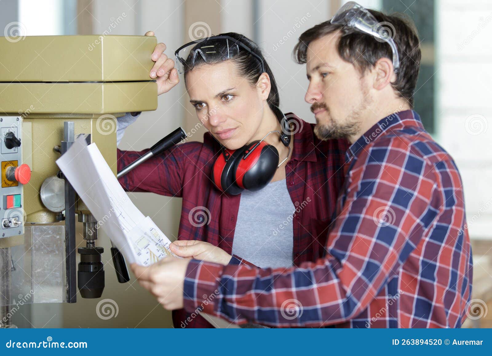Instructor Showing Trainee How To Use Sawing Machine Stock Photo ...