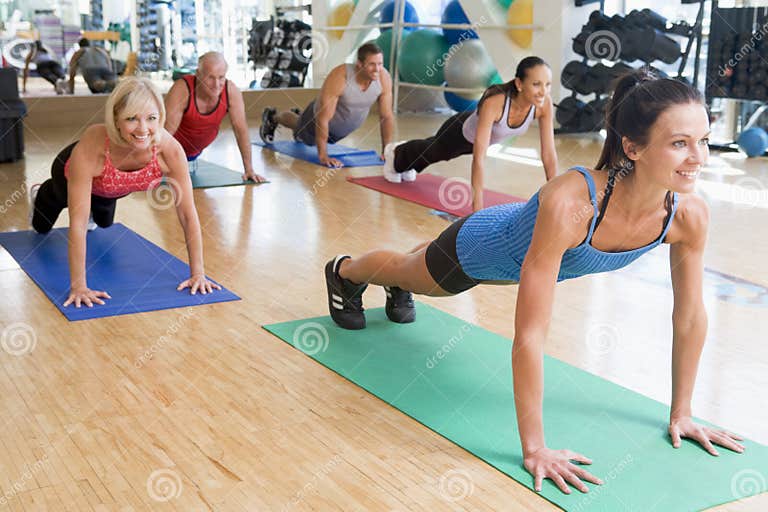 Instructor Taking Exercise Class at Gym Stock Image - Image of middle ...