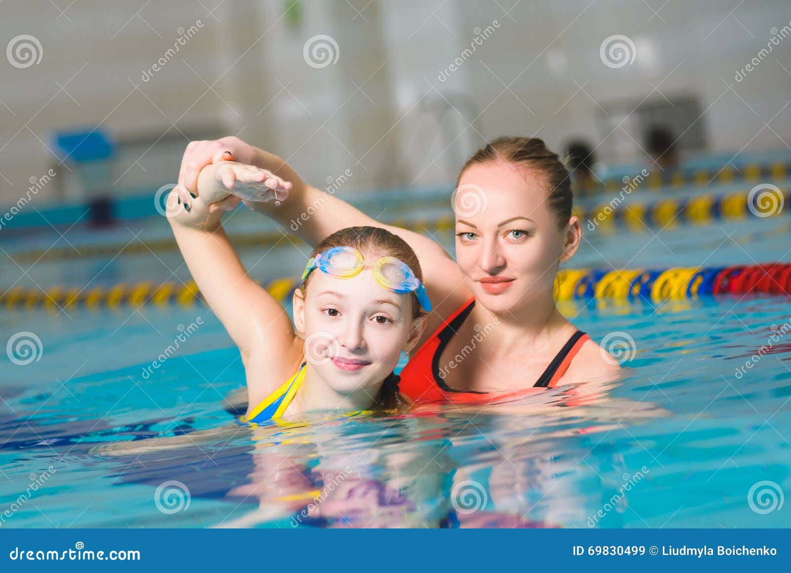 Instructor Teaches the Girl Swimming in a Pool Stock Image - Image of ...