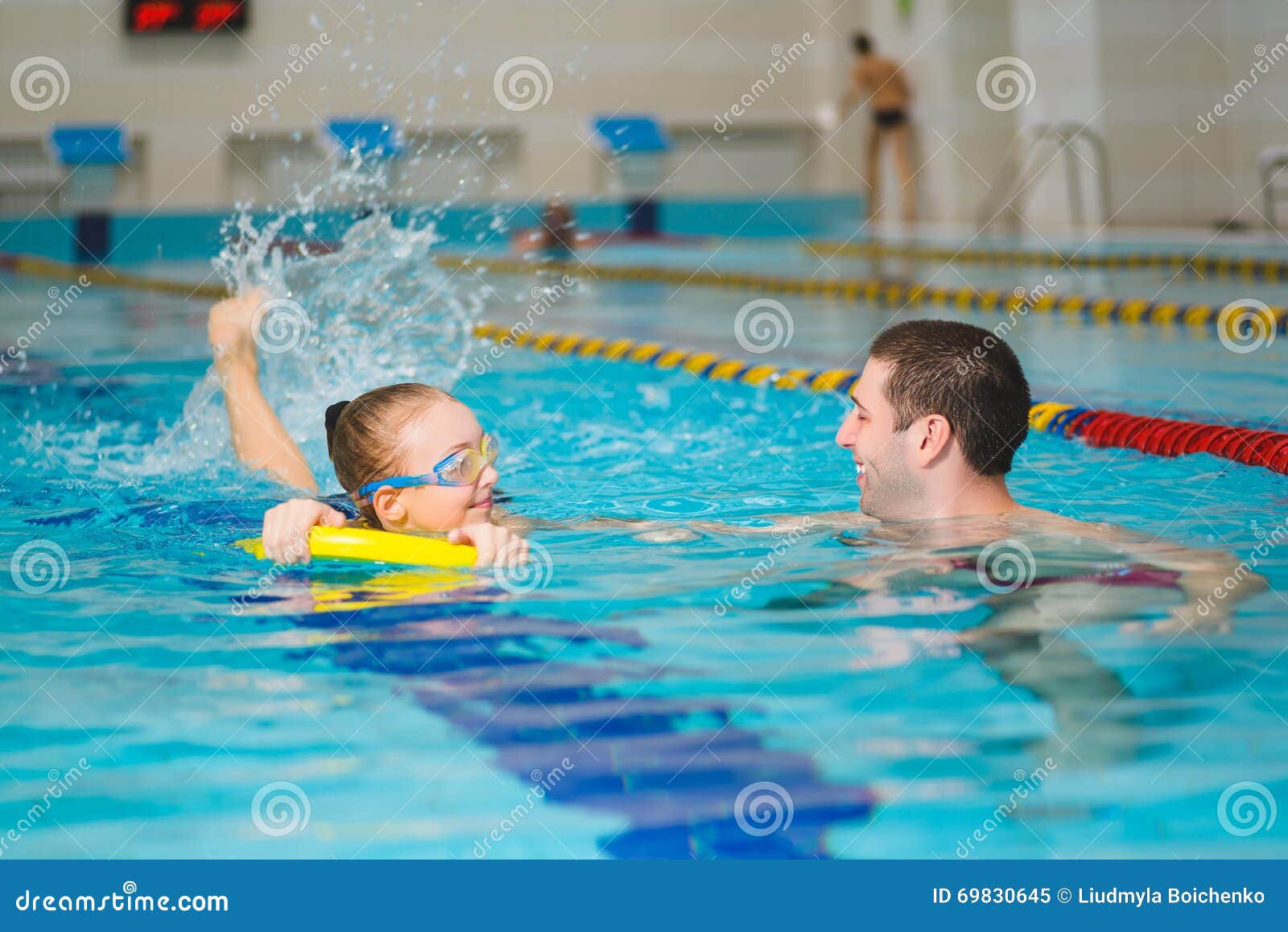 Instructor Teaches The Girl Swimming In A Pool Stock Image Image Of Instructor Happy 69830645