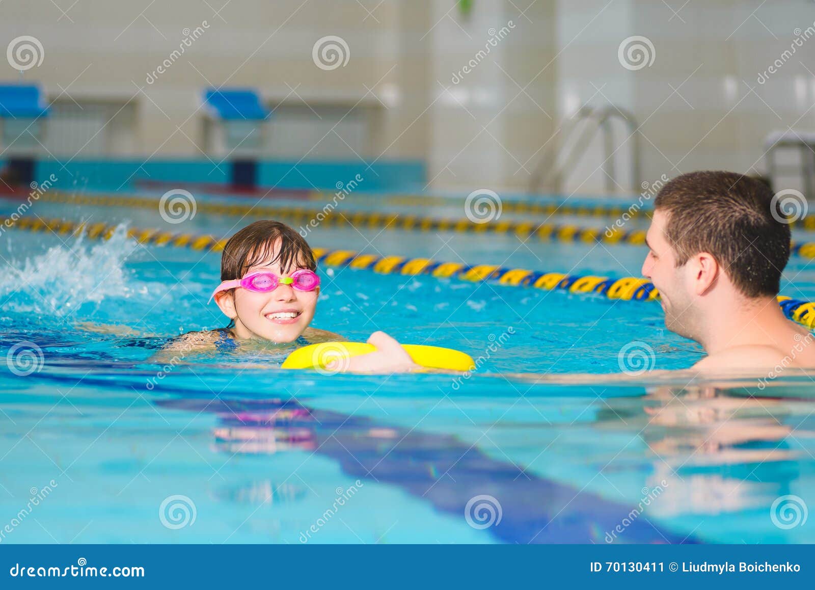 Instructor Teaches the Girl Swimming in a Pool Stock Image - Image of ...