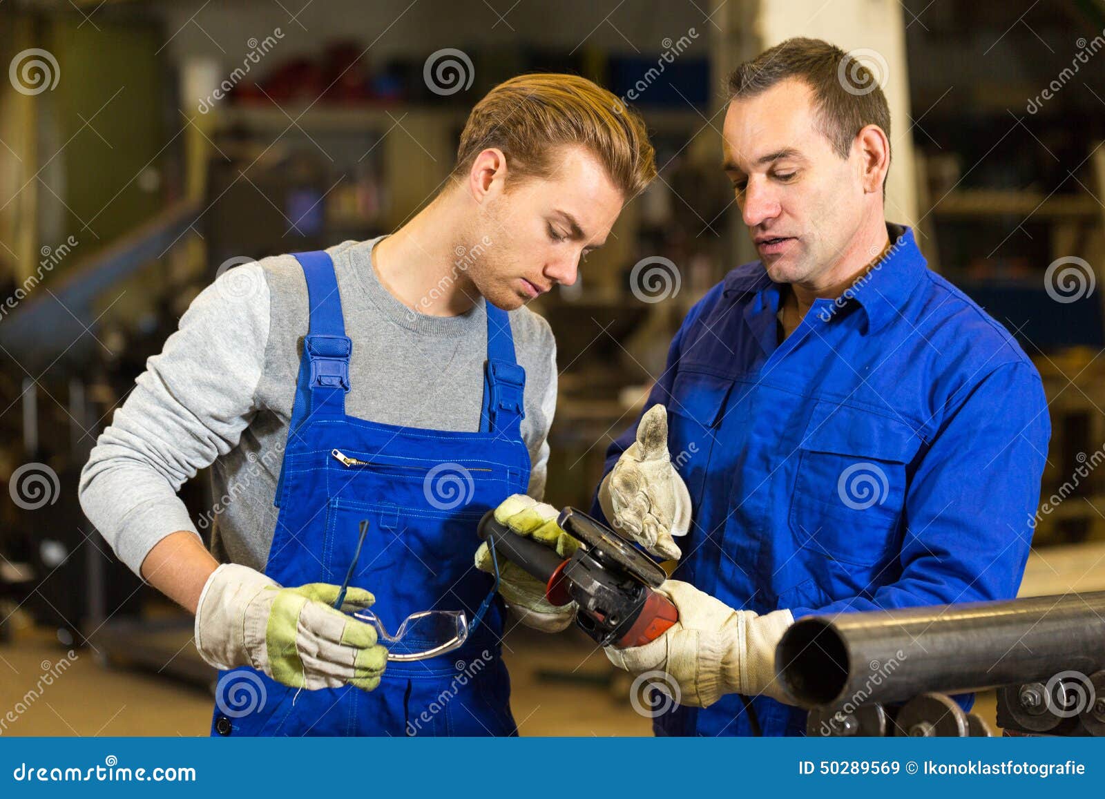 Instructor Teaches Trainee How To Use an Angle Grinder Stock Image ...