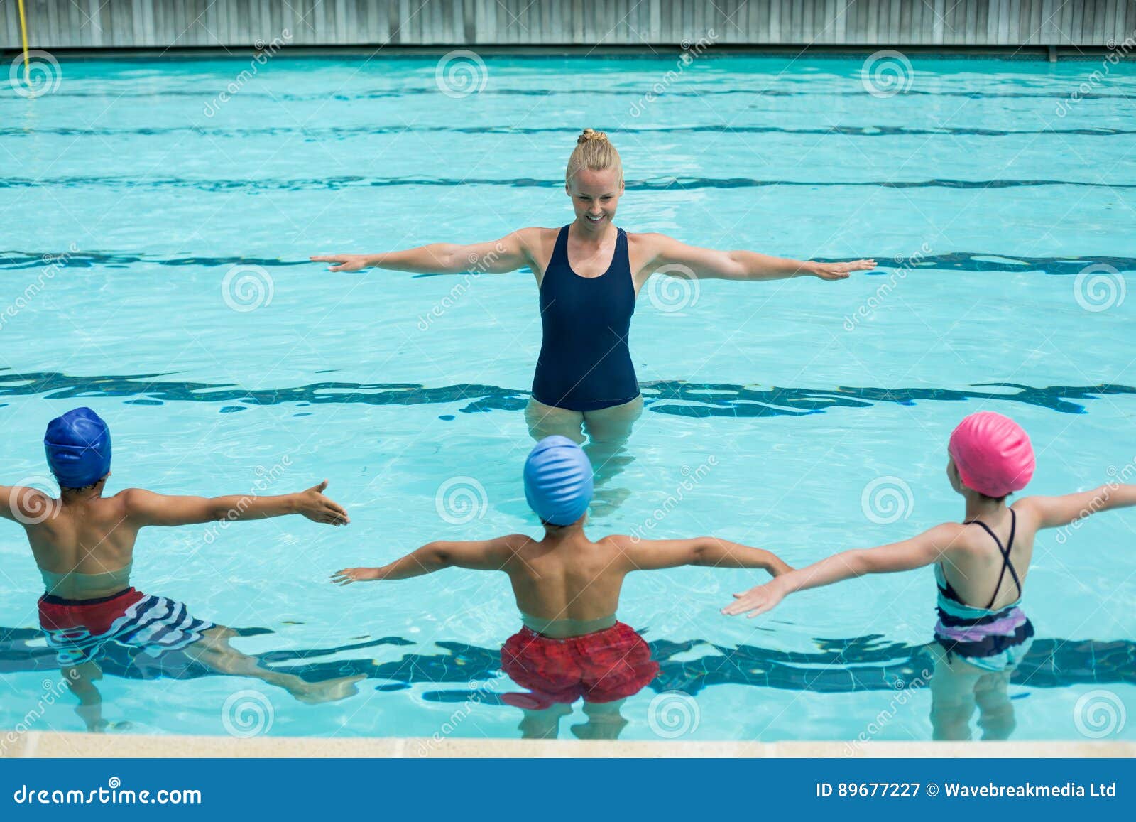 Instructor Teaching Students in Swimming Pool Stock Image - Image of ...