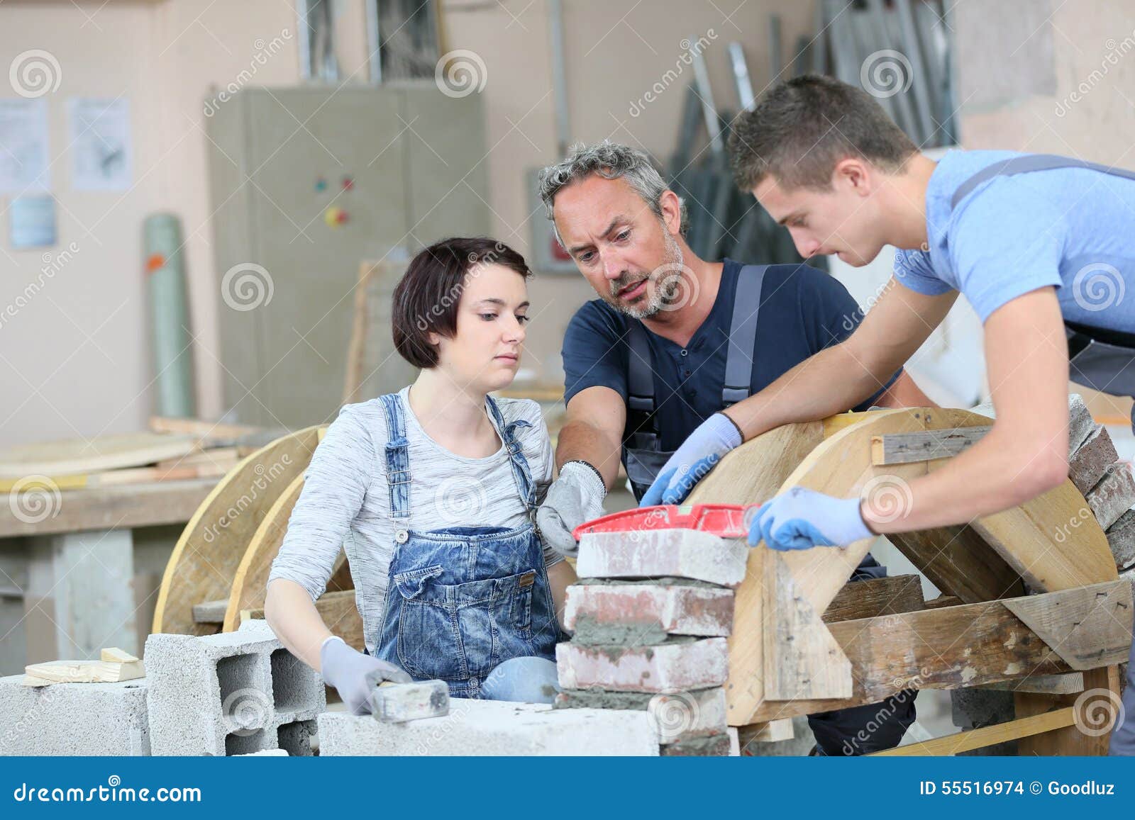 Instructor Teaching Trainees Laying Bricks Stock Photo - Image of ...