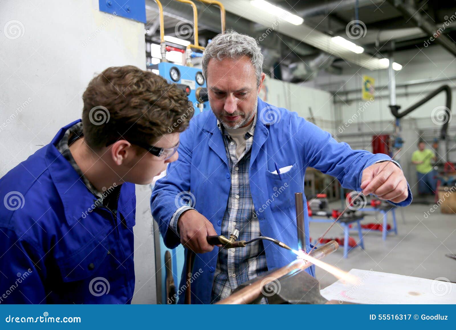 Instructor Teaching Young Apprentice Mettallurgy Stock Image - Image of ...