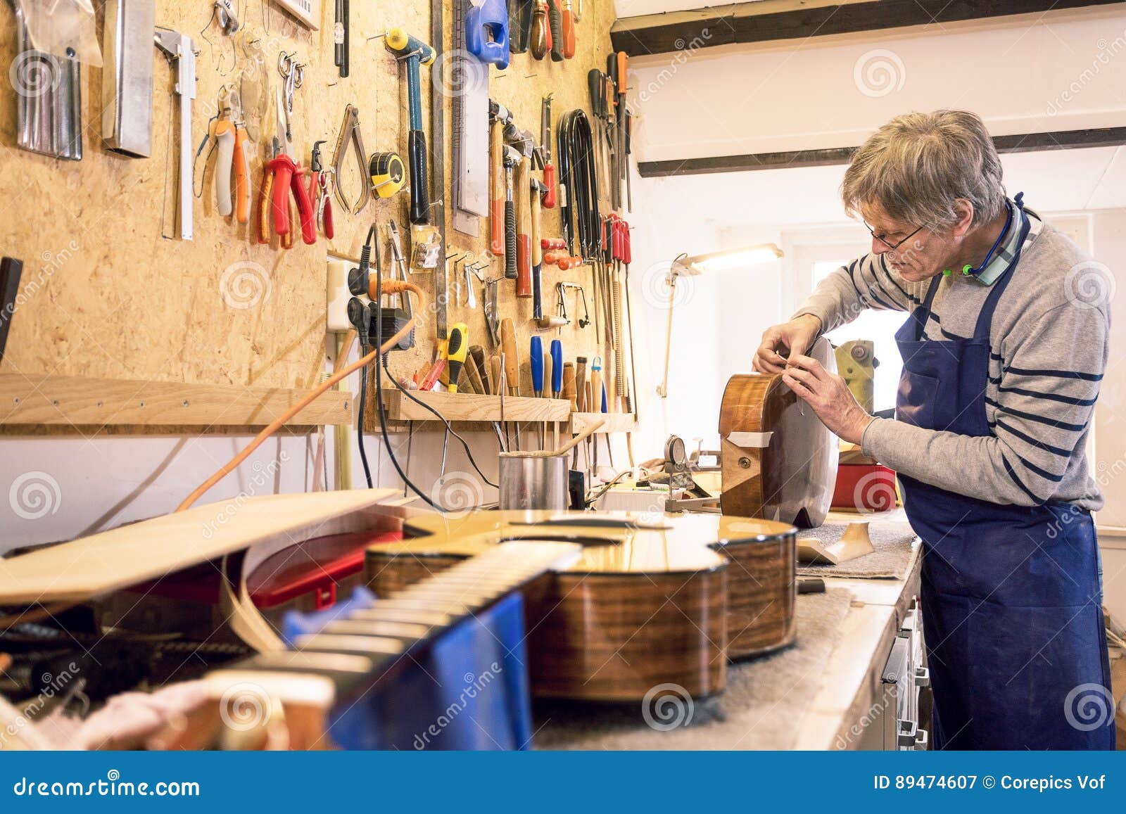 Instrument Maker Repairing An Old Acoustic Guitar Stock Image Image