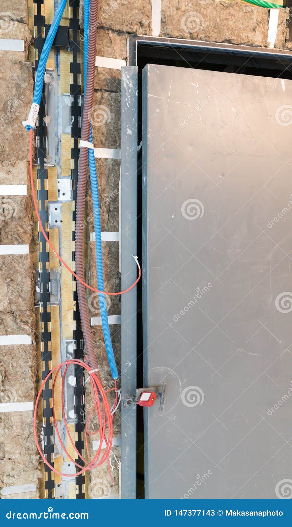 Insulation and Electrical Wiring Around an Elevator Shaft on a ...