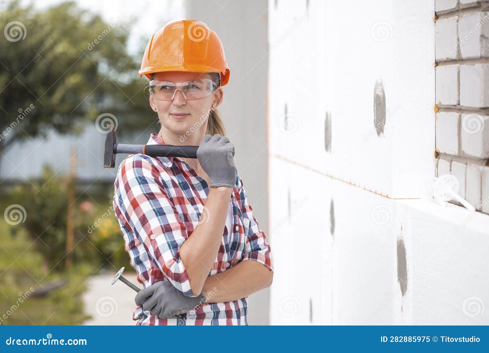 Insulation of the House with Polyfoam. the Worker is Checking with the ...