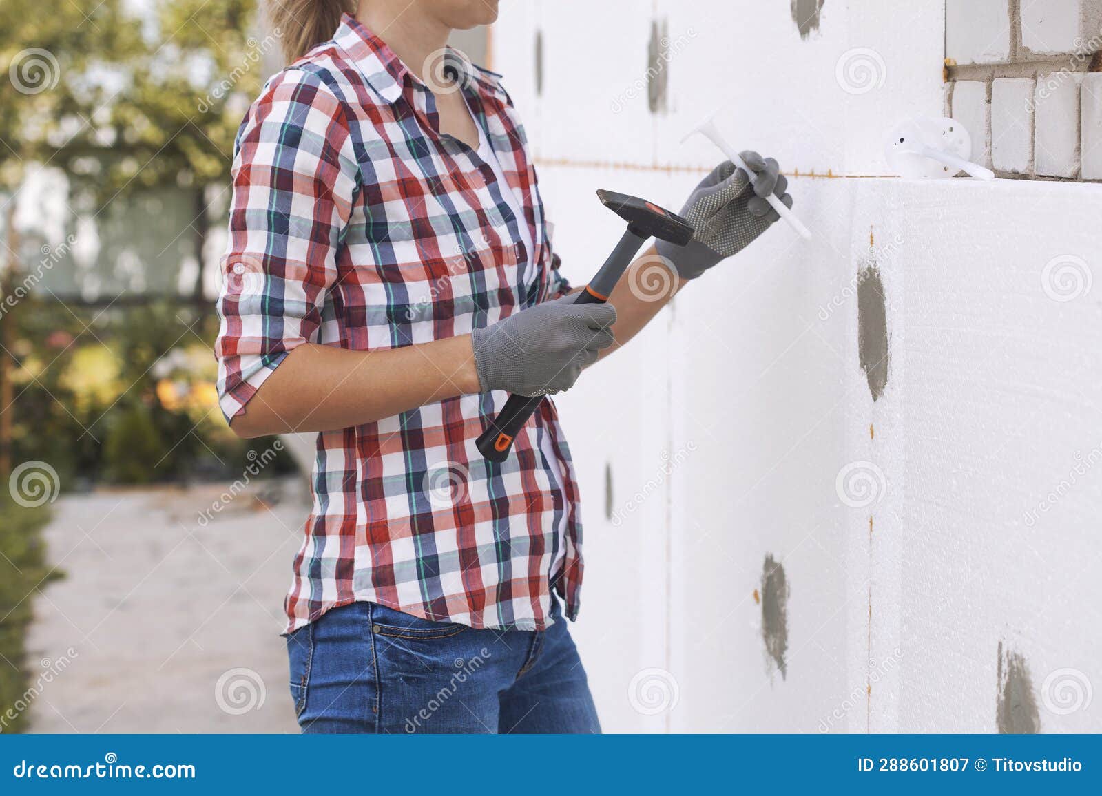 Insulation of the House with Polyfoam. the Worker is Checking with the ...