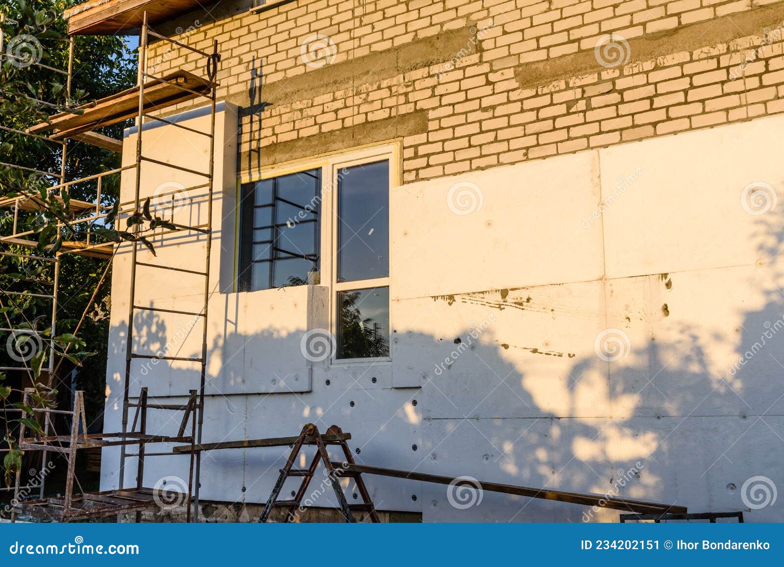 Insulation of the House with Styrofoam. Scaffold on Building Stock ...