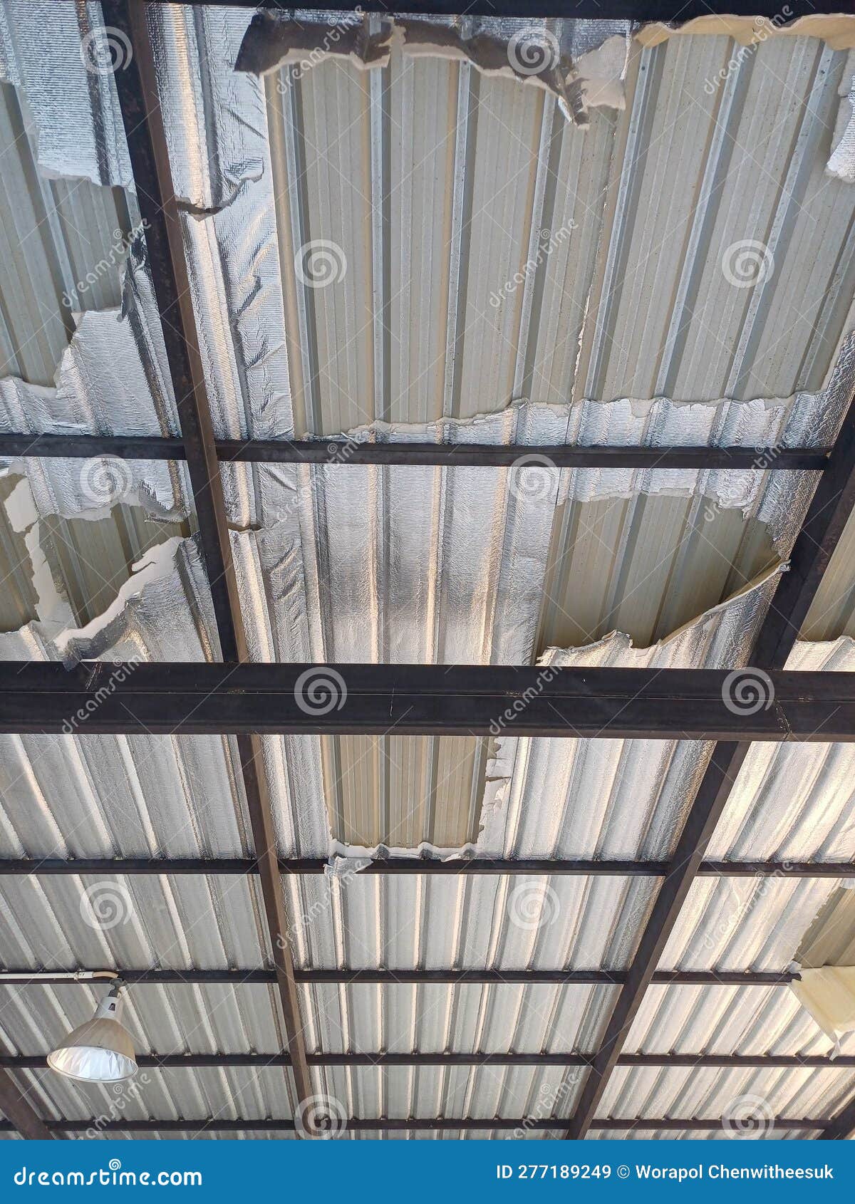 The Insulation Under the Roof is Torn and Frayed. Stock Image - Image ...
