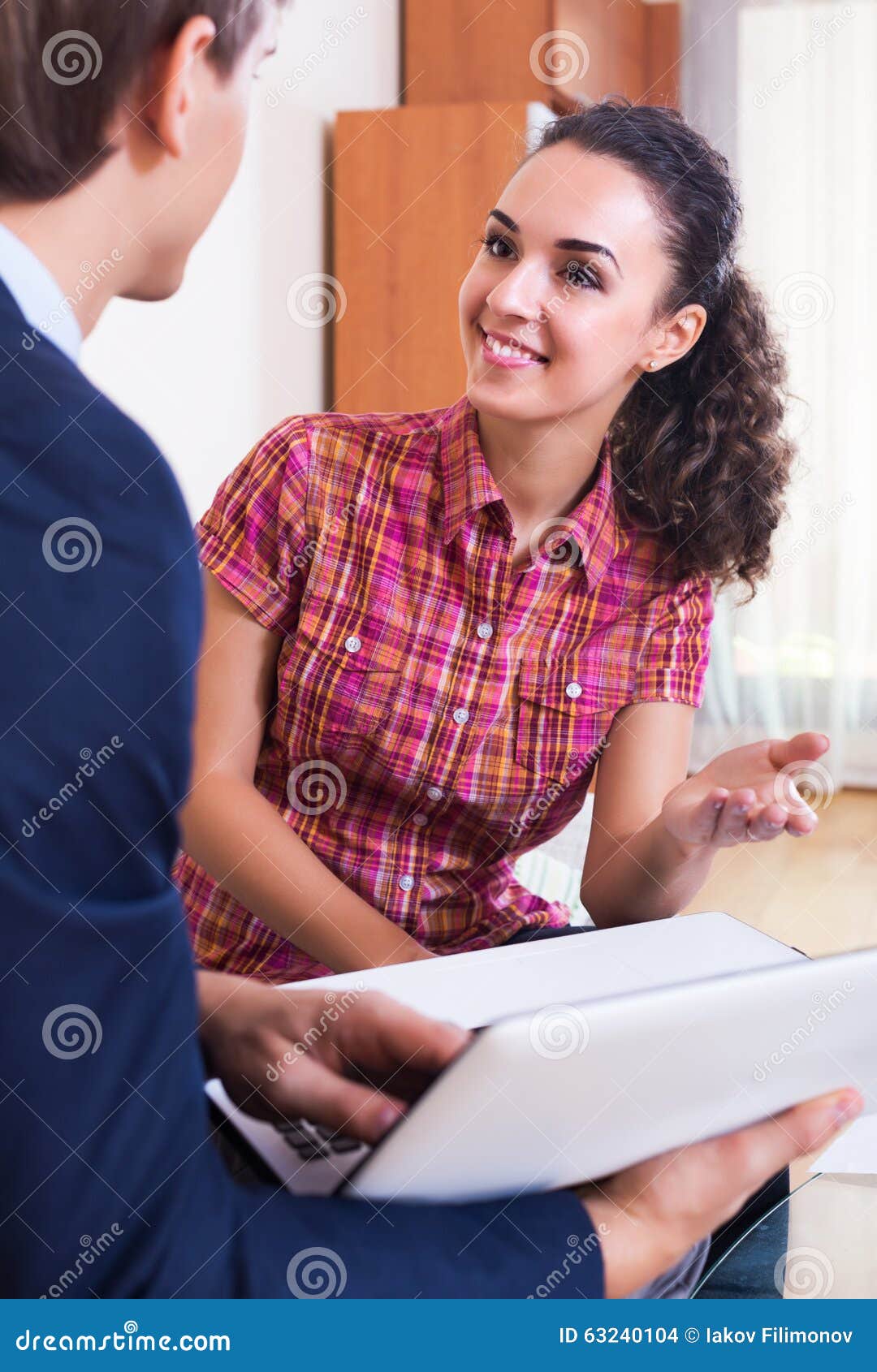 Insurance Agent and Customer Discussing Stock Photo - Image of contract ...