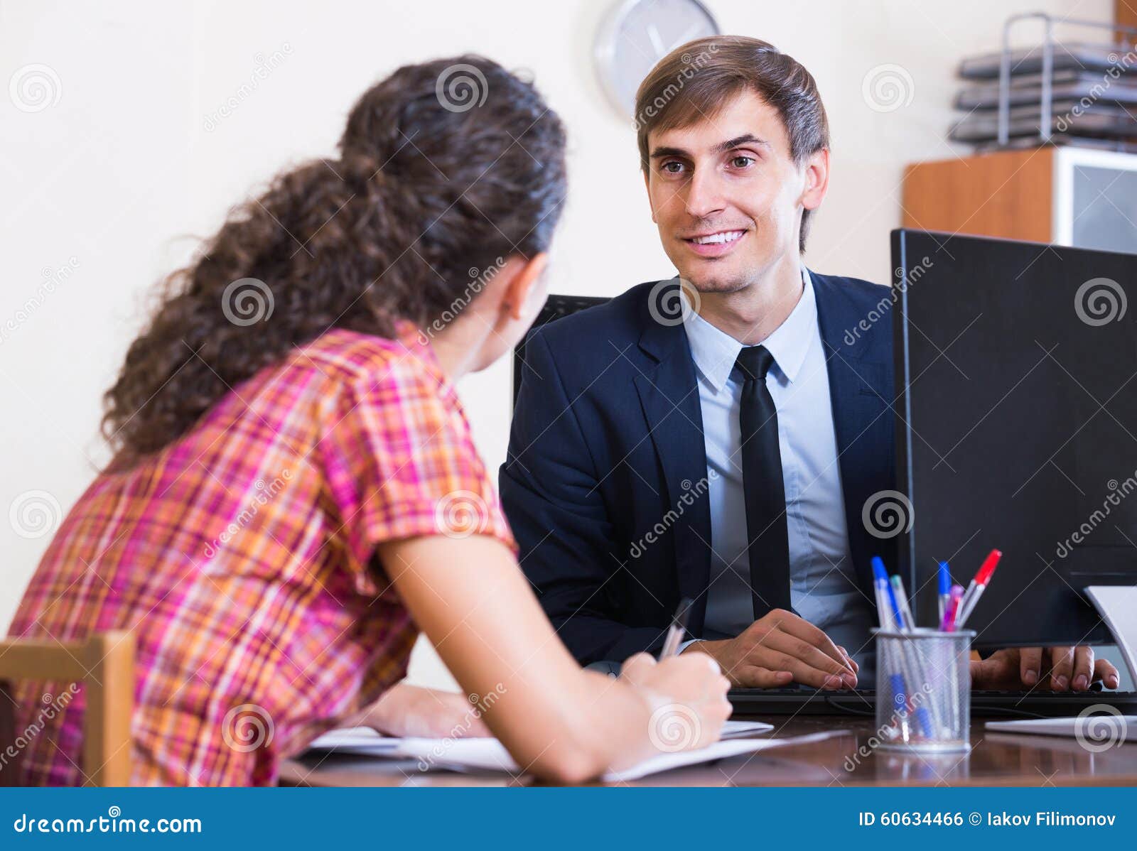 Insurance Agent and Customer Discussing Agreement Terms Stock Photo ...