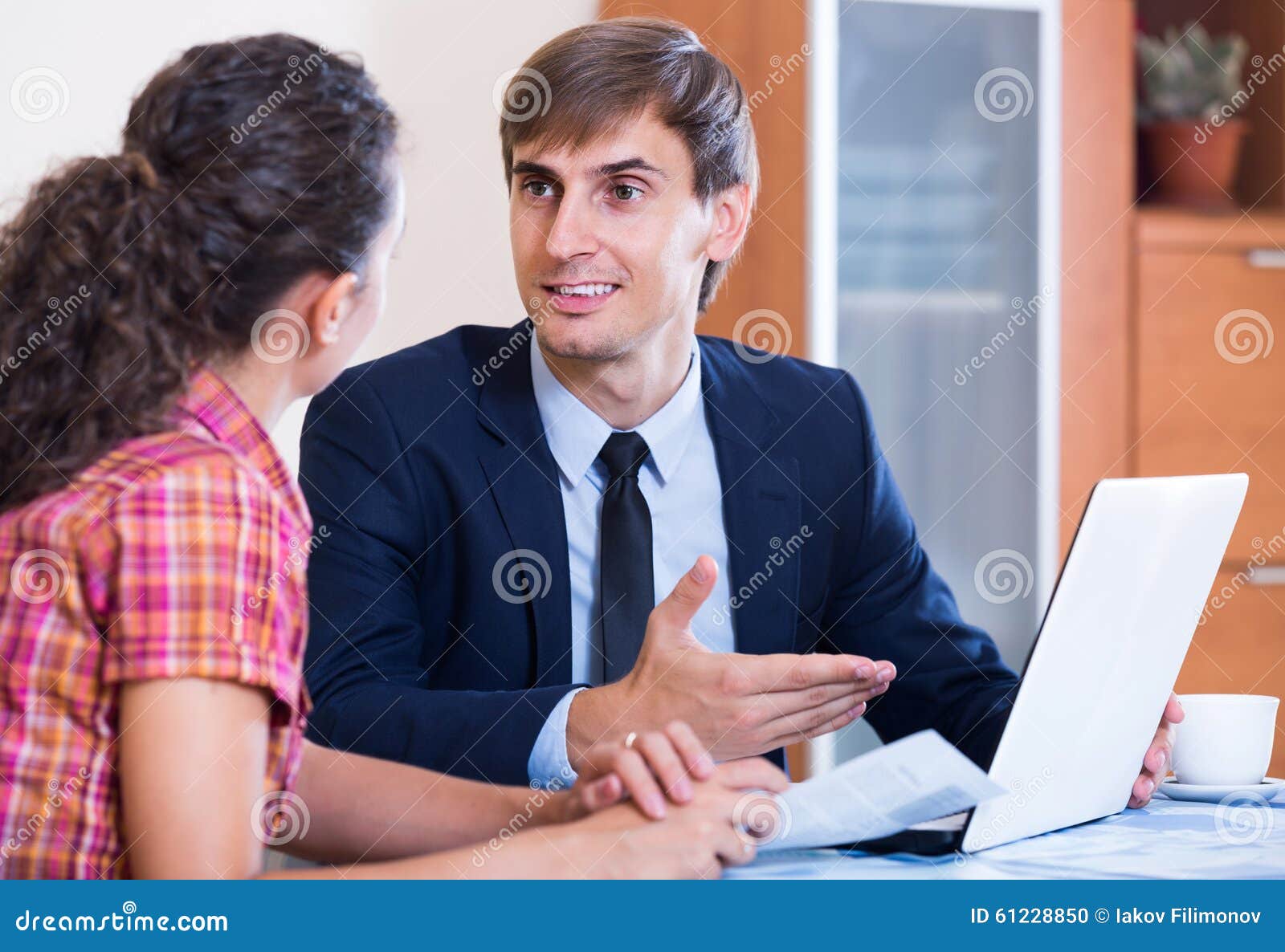 Insurance Agent and Customer Discussing Agreement Terms Stock Photo ...
