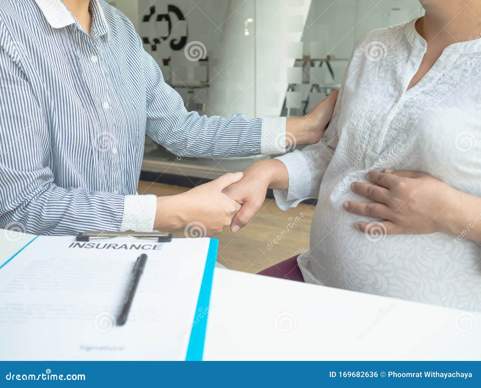 Insurance Agent Holding Chart and Explain Insurance Policy To Pregnant ...