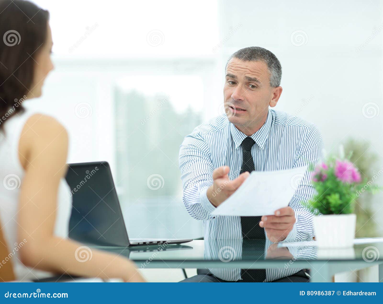 Insurance Agent Shows the Contract To the Client in the Office B Stock ...