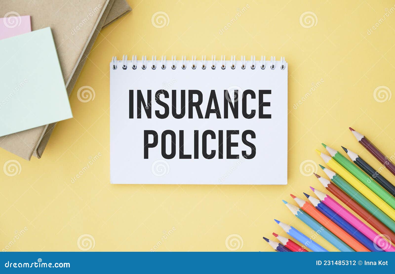Insurance Policy Text in a Notebook on a Yellow Background Stock Photo ...