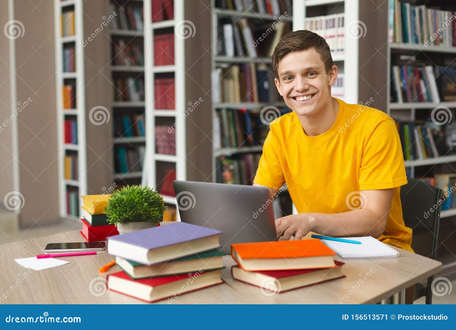 Happy Intelligent Student Getting Ready for Exams in School Library ...