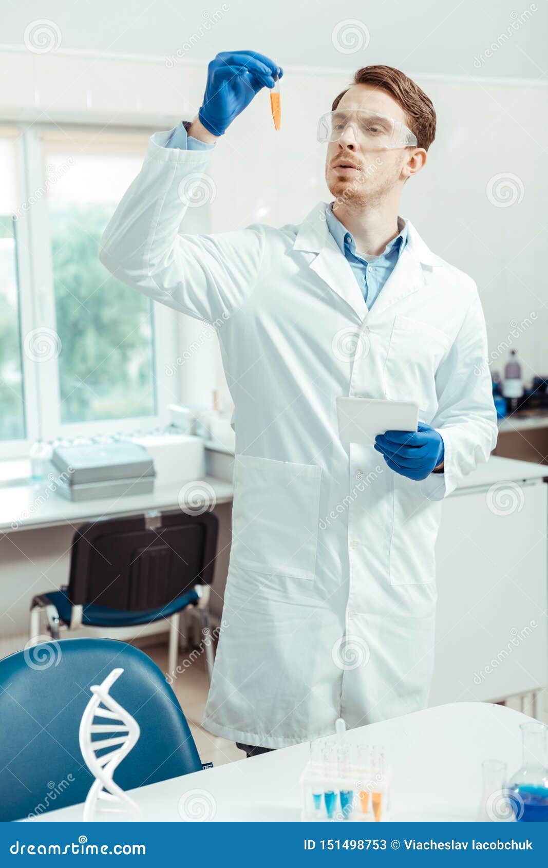 Intelligent Talented Scientist Looking at the Test Tube Stock Image ... Intelligent Talented Scientist Looking at the Test Tube Stock Image ...