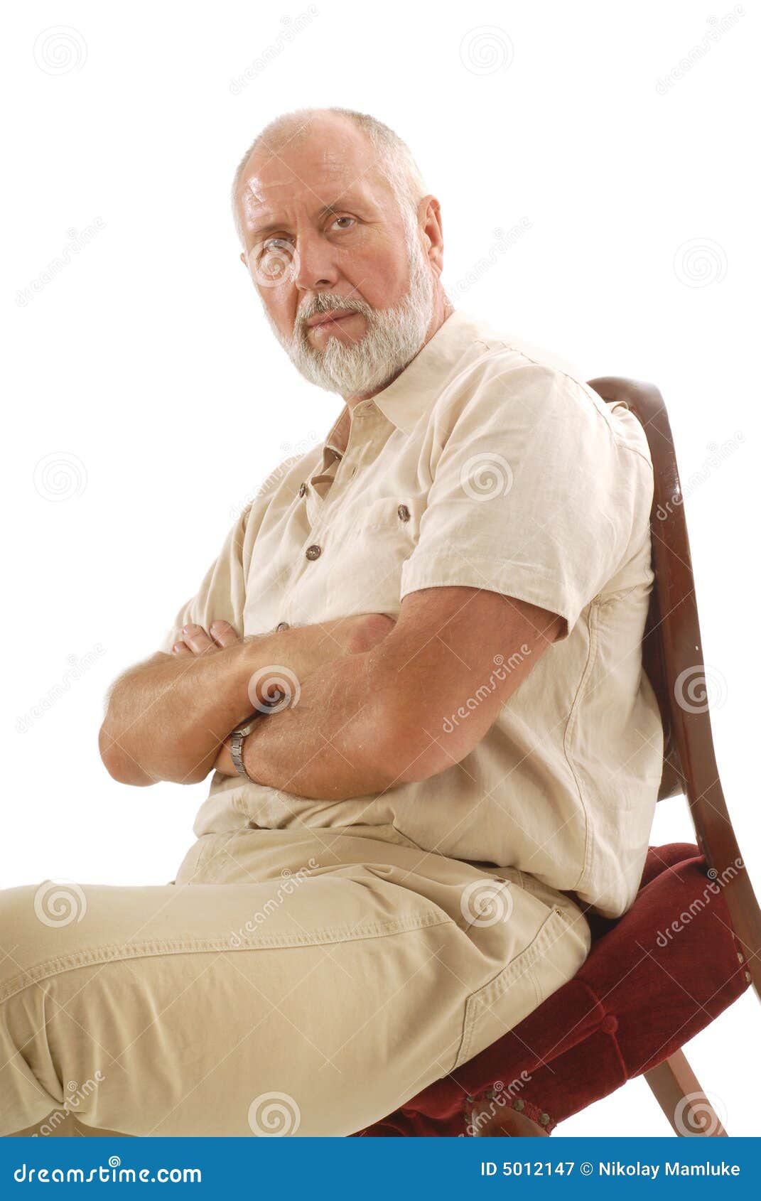 Intense older man stock image. Image of arms, chair, mature - 5012147