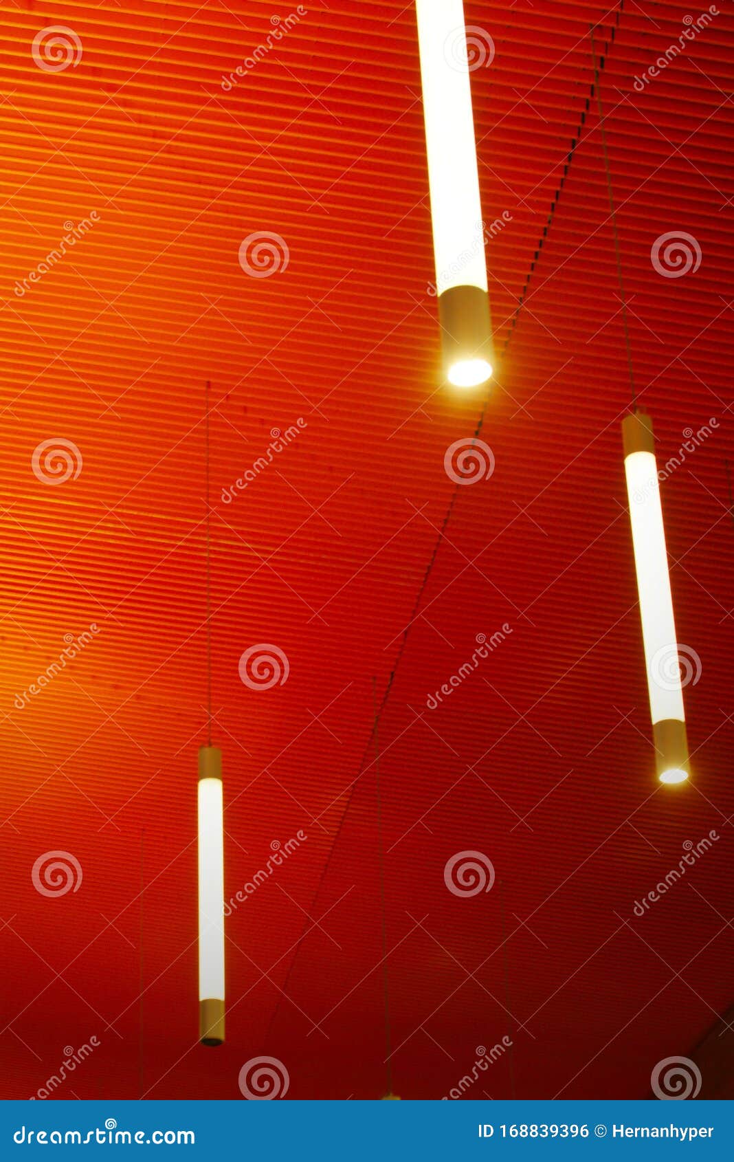 Intense Orange Ceiling with Vertical Light Tubes Stock Photo - Image of ...
