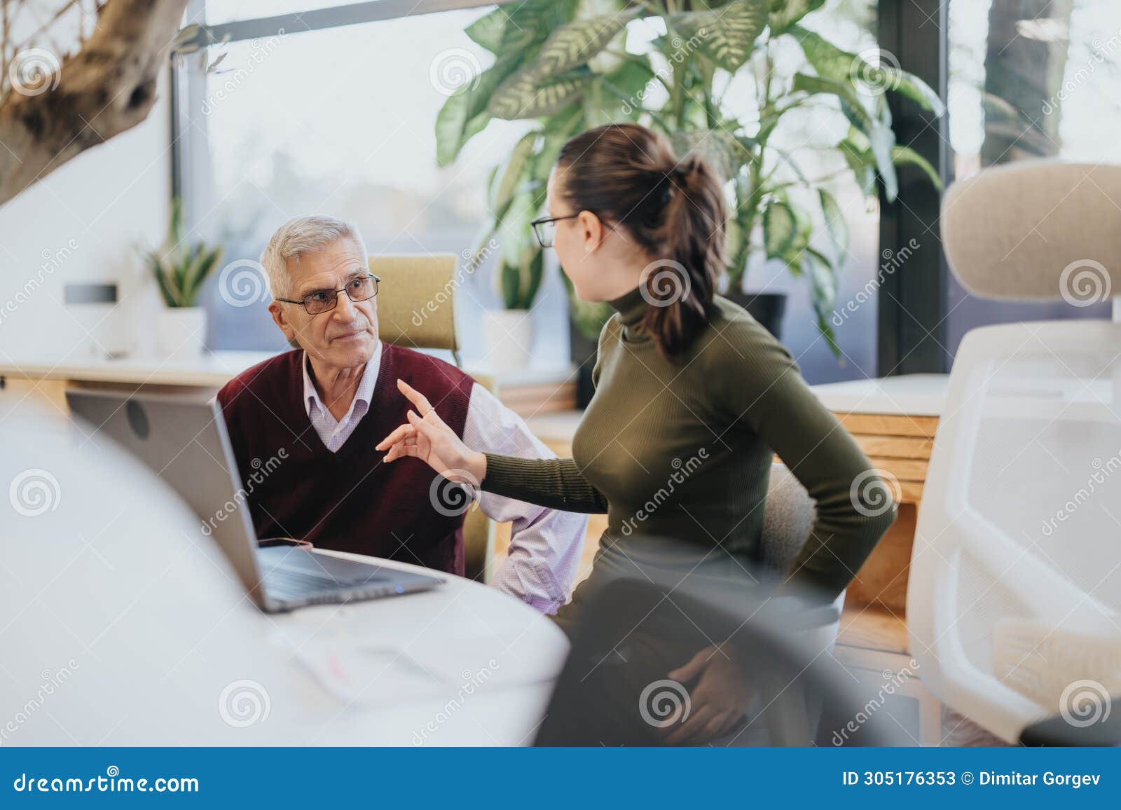 Creative, Cross Generational Business Coworkers Collaborating on a ...