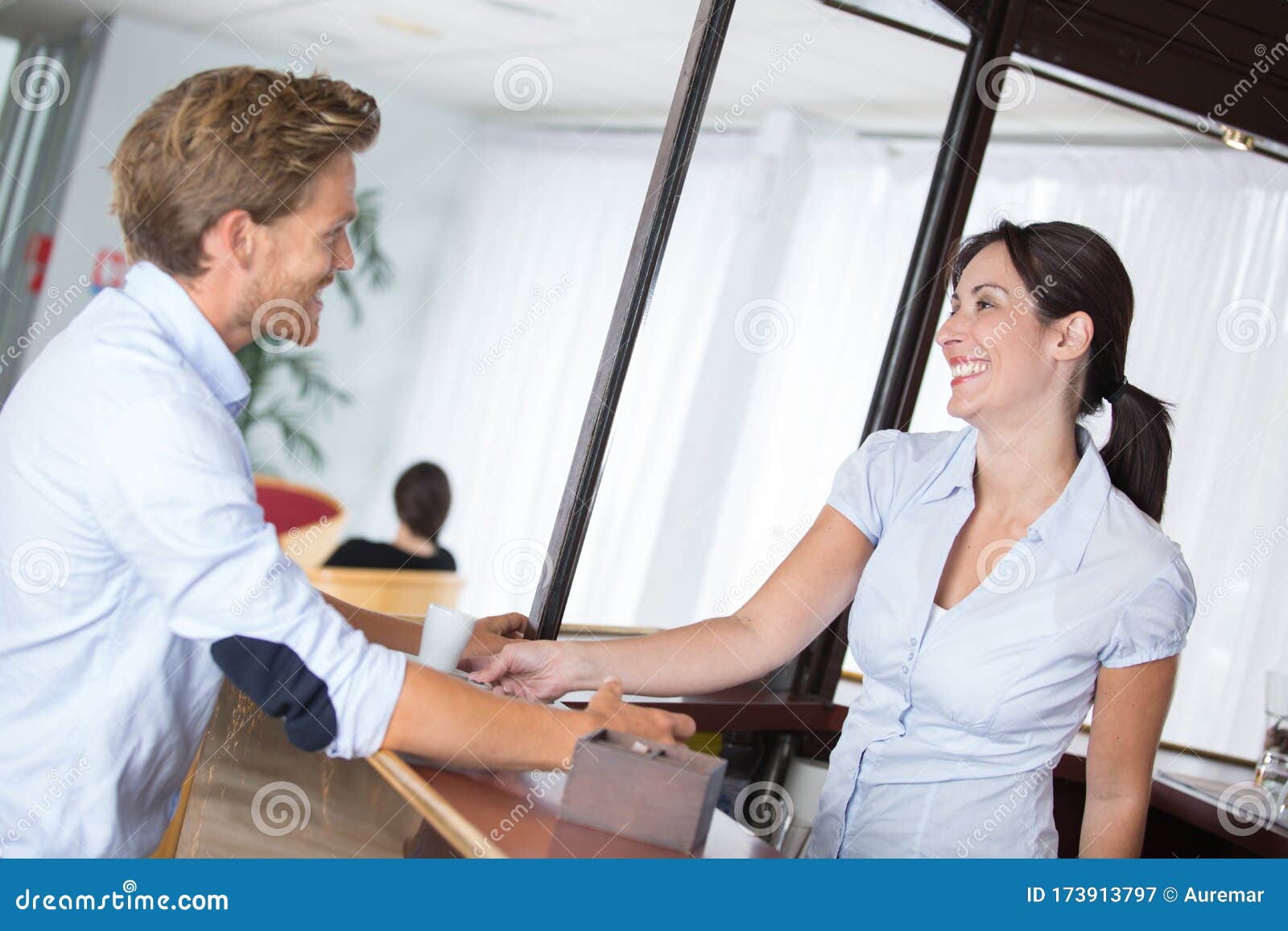 Interaction at front desk stock image. Image of client - 173913797