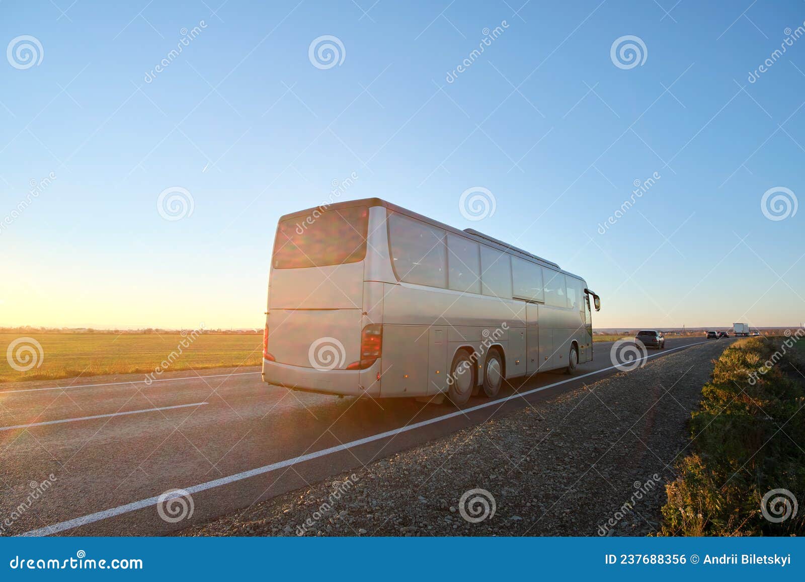 Intercity Passenger Bus Driving on Highway in Evening Stock Photo ...