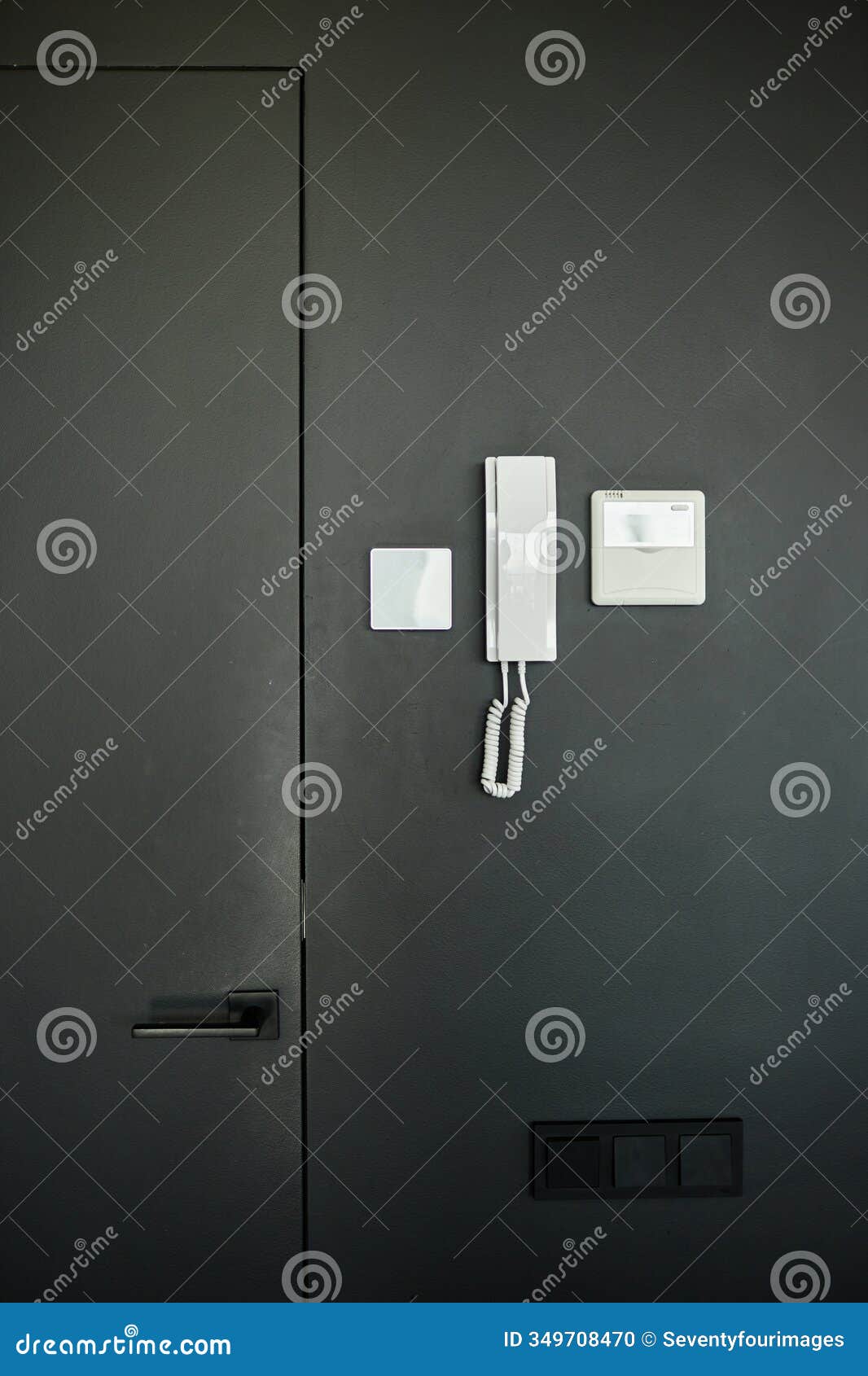 Intercom Handset with Electronic Video Panel Mounted on Black Wall in ...