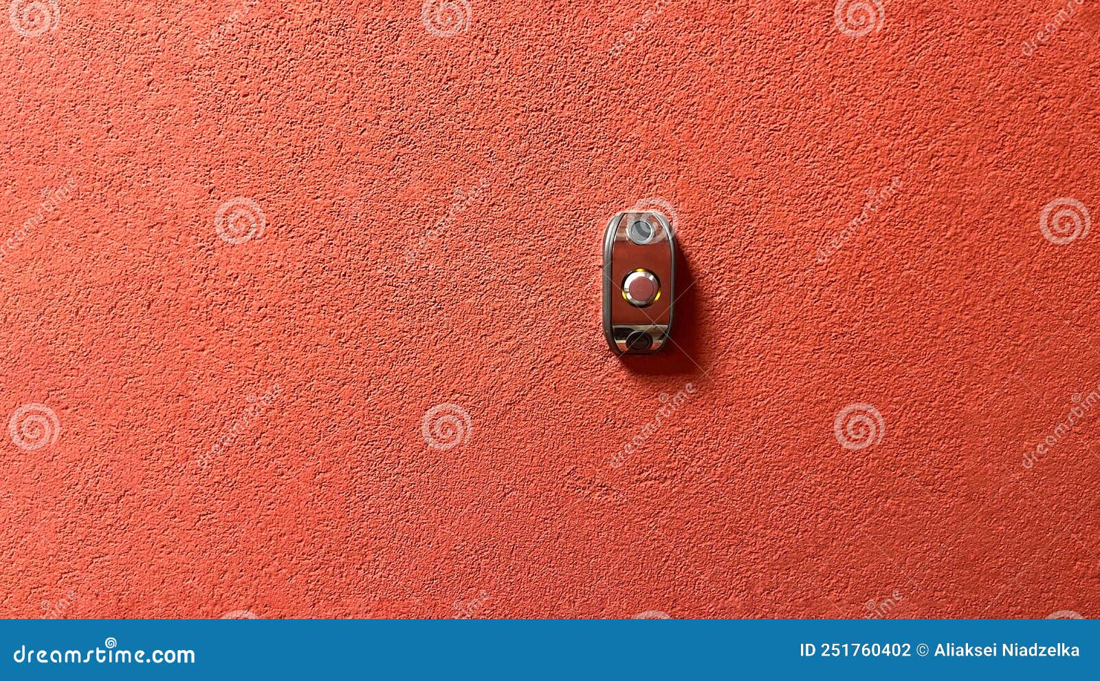 An Intercom with a Metal Call Button Mounted on a Red Wall, a Help or ...