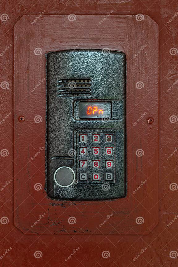 An Intercom on Old Painted Brown Steel Surface with a Keypad, Digital ...