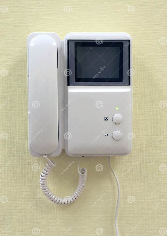 Intercom on yellow wall stock photo. Image of cable, safety - 7325046