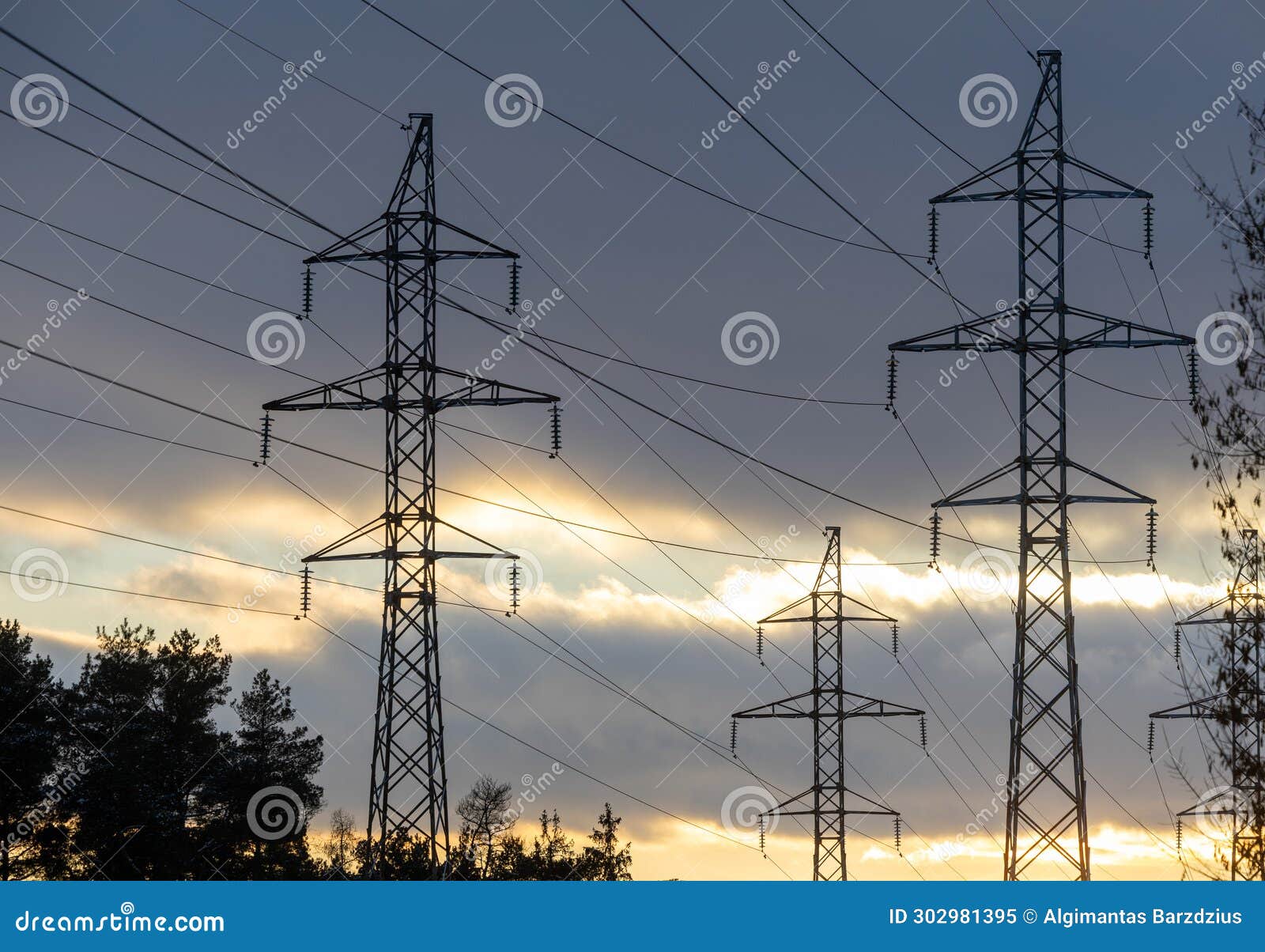 Interconnected Web of Electrical Towers Against a Sunset Sky Stock ...