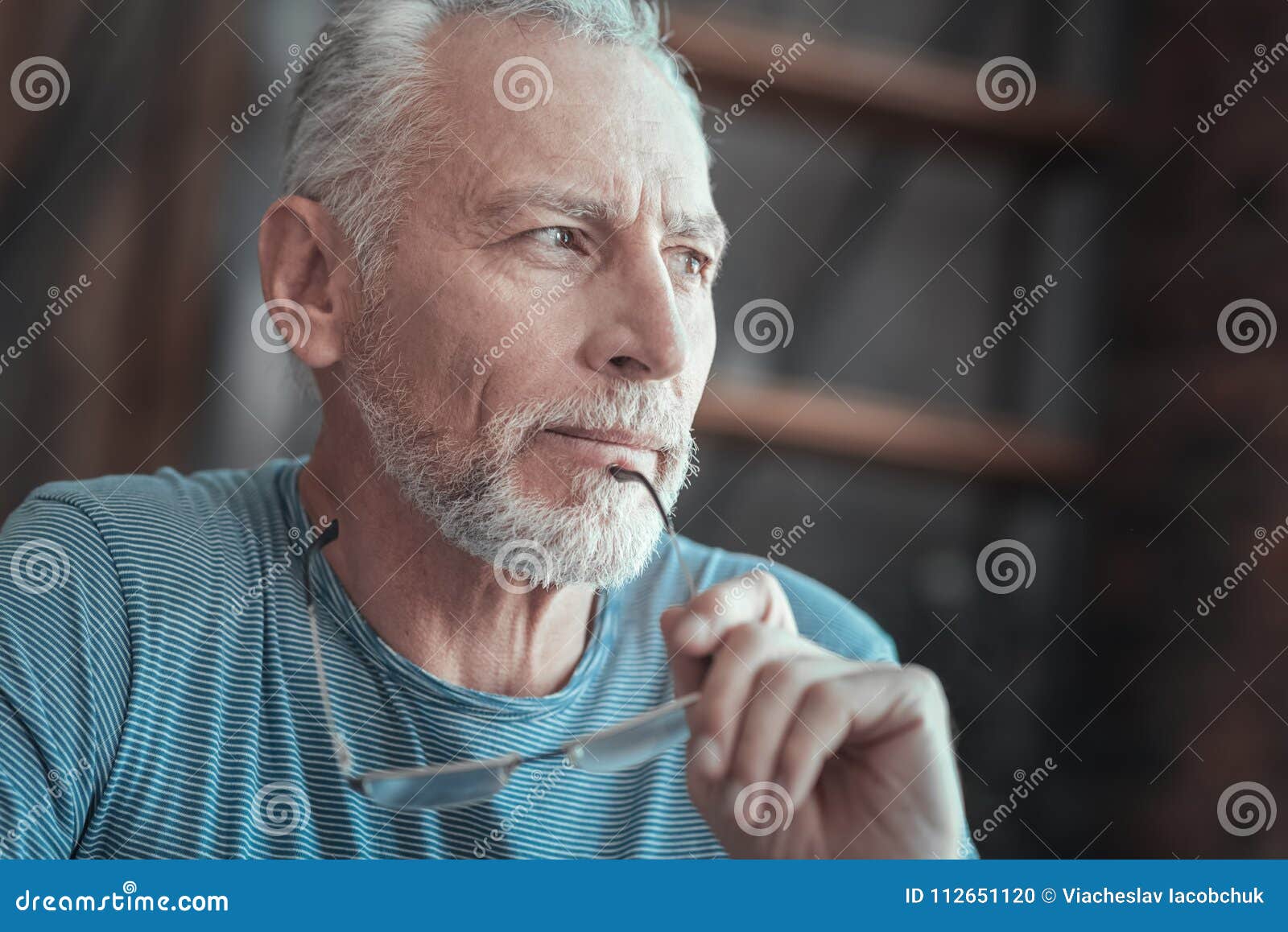 Interested Deep Man Thinking and Holding the Glasses. Stock Photo ...