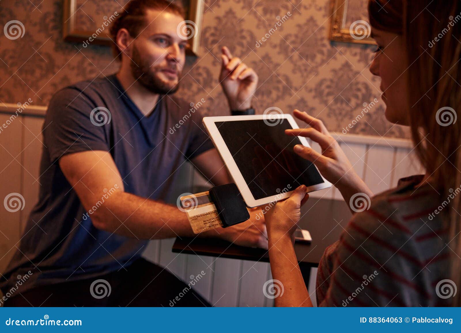 Interested Young Man Paying at Bar Stock Image - Image of long, hands ...