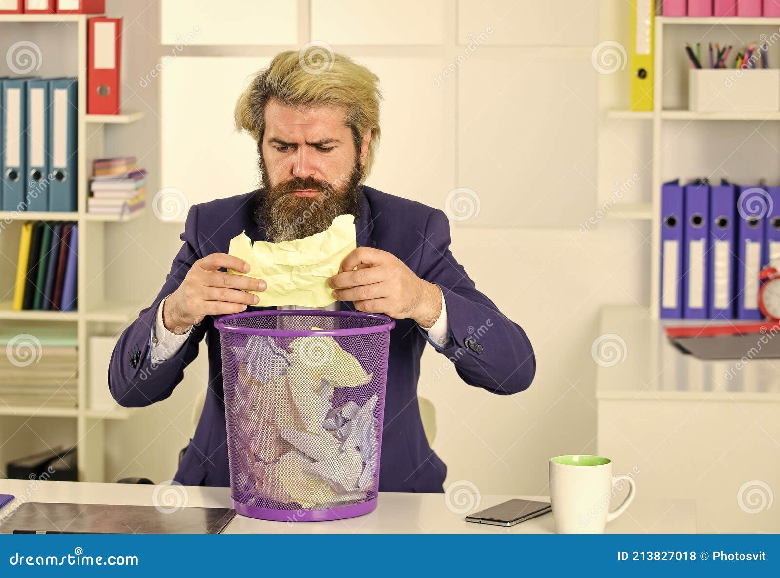 Interesting Info. Man in Office Look for Lost Note in Paper Bin ...