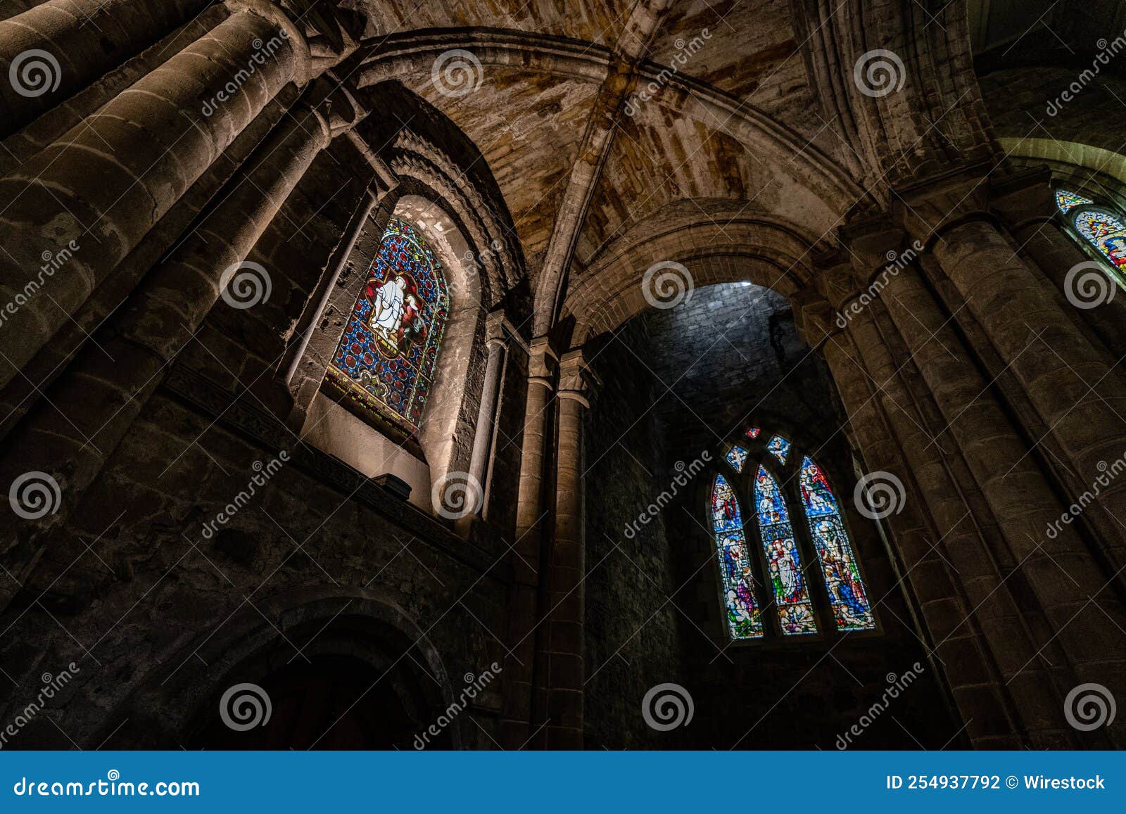 Interior of an Ancient Stone Cathedral with Arches and Strained Glass ...