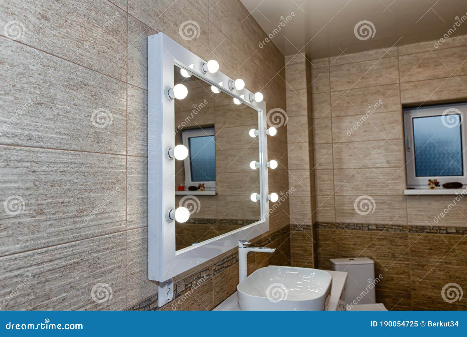 The Interior of the Bathroom with a Big Illuminated Mirror Stock Image ...